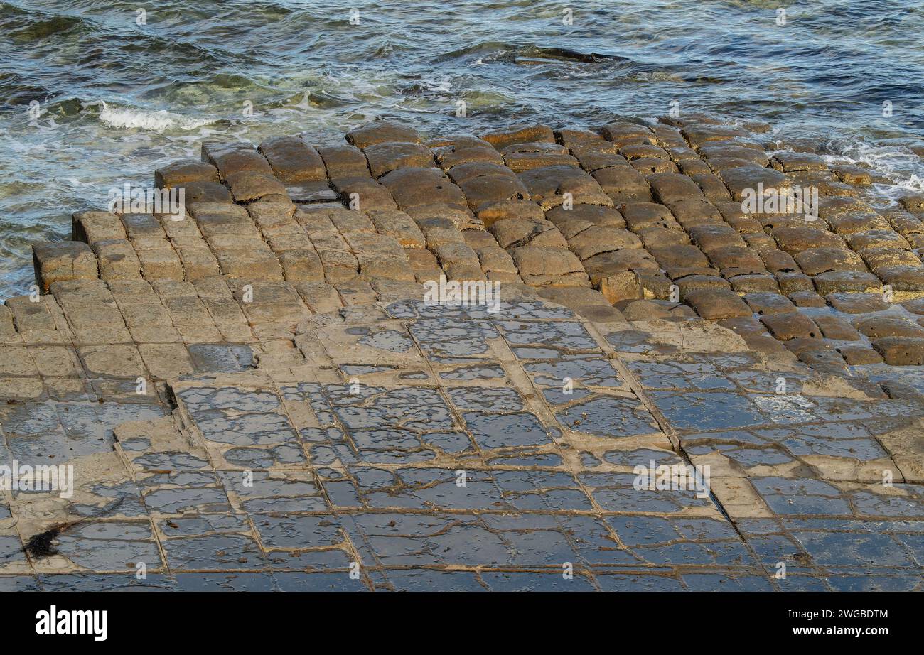 Tessellated pavement, at Pirates Bay, Tasmania. An eroded marine ...