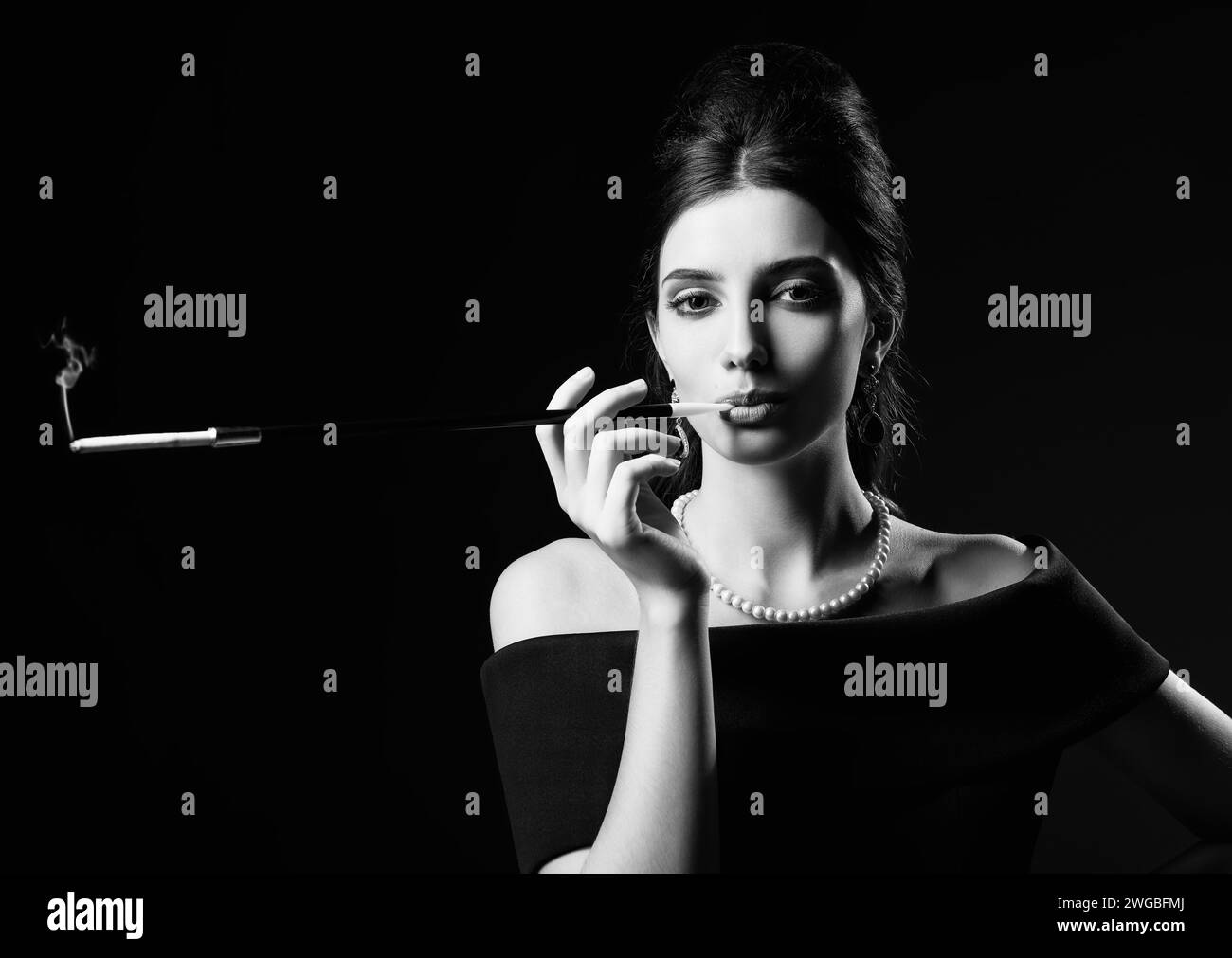 Posh girl smoking a cigarette hi-res stock photography and images - Alamy