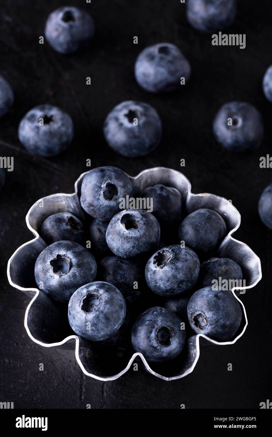 in the foreground fresh blueberries in an aluminum cake pan Stock Photo ...