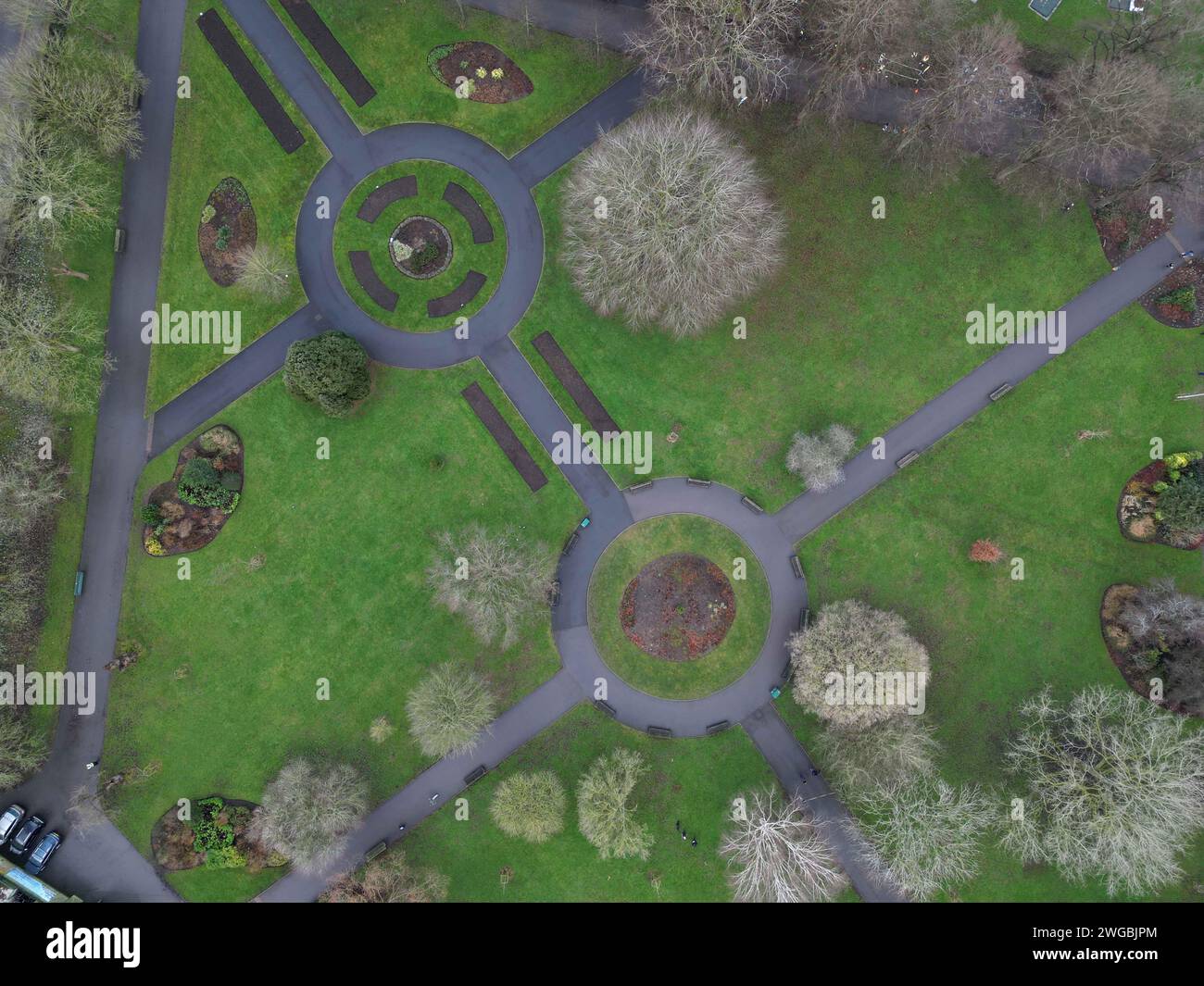 People walk through the gardens of St Nicholas' Park, Warwick, on an ...