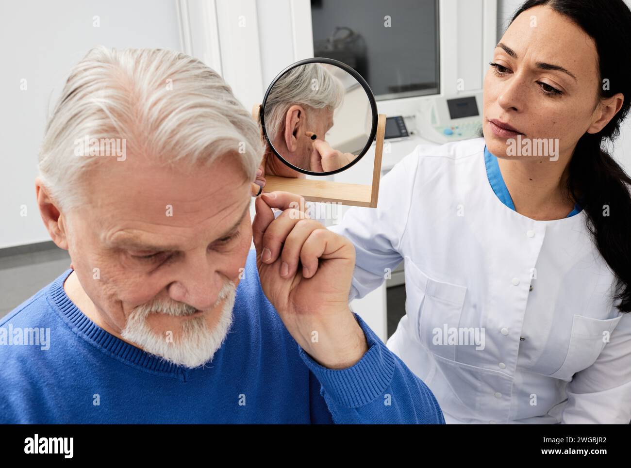 Hearing solutions positive senior hi-res stock photography and images ...