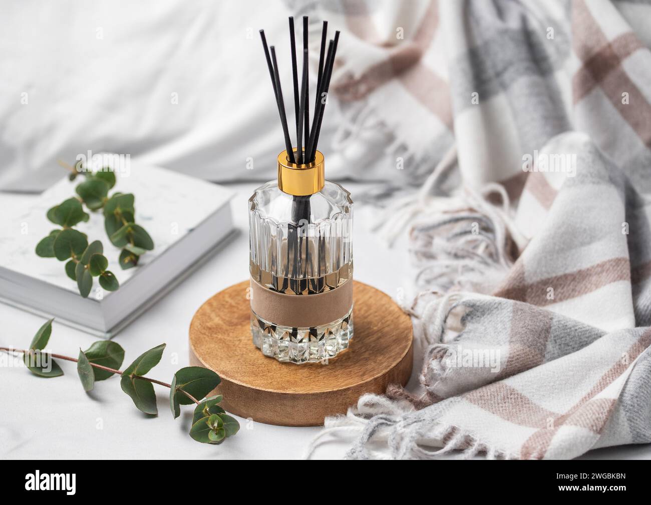 Aromatic reed air freshener, eucalyptus leaves and candle on the ...