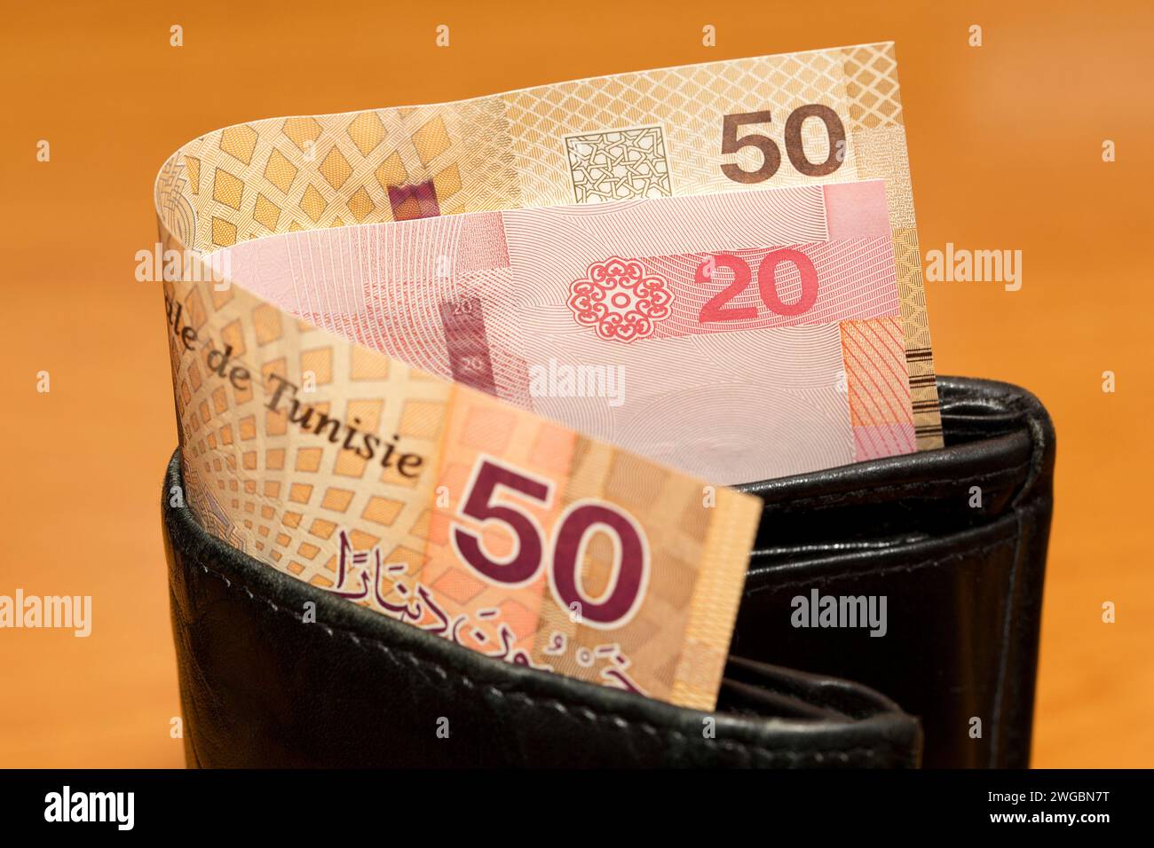 Tunisian money - Dinar in the black wallet Stock Photo - Alamy