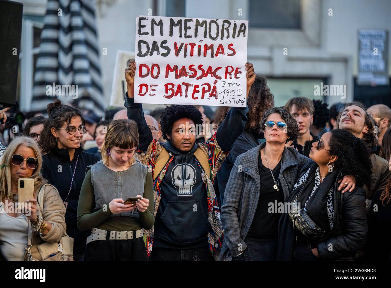 A protester holds a placard expressing his opinion during the ...