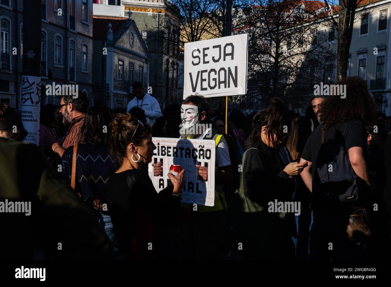 Lisbon, Portugal. 03rd Feb, 2024. A masked protester holds a placard ...
