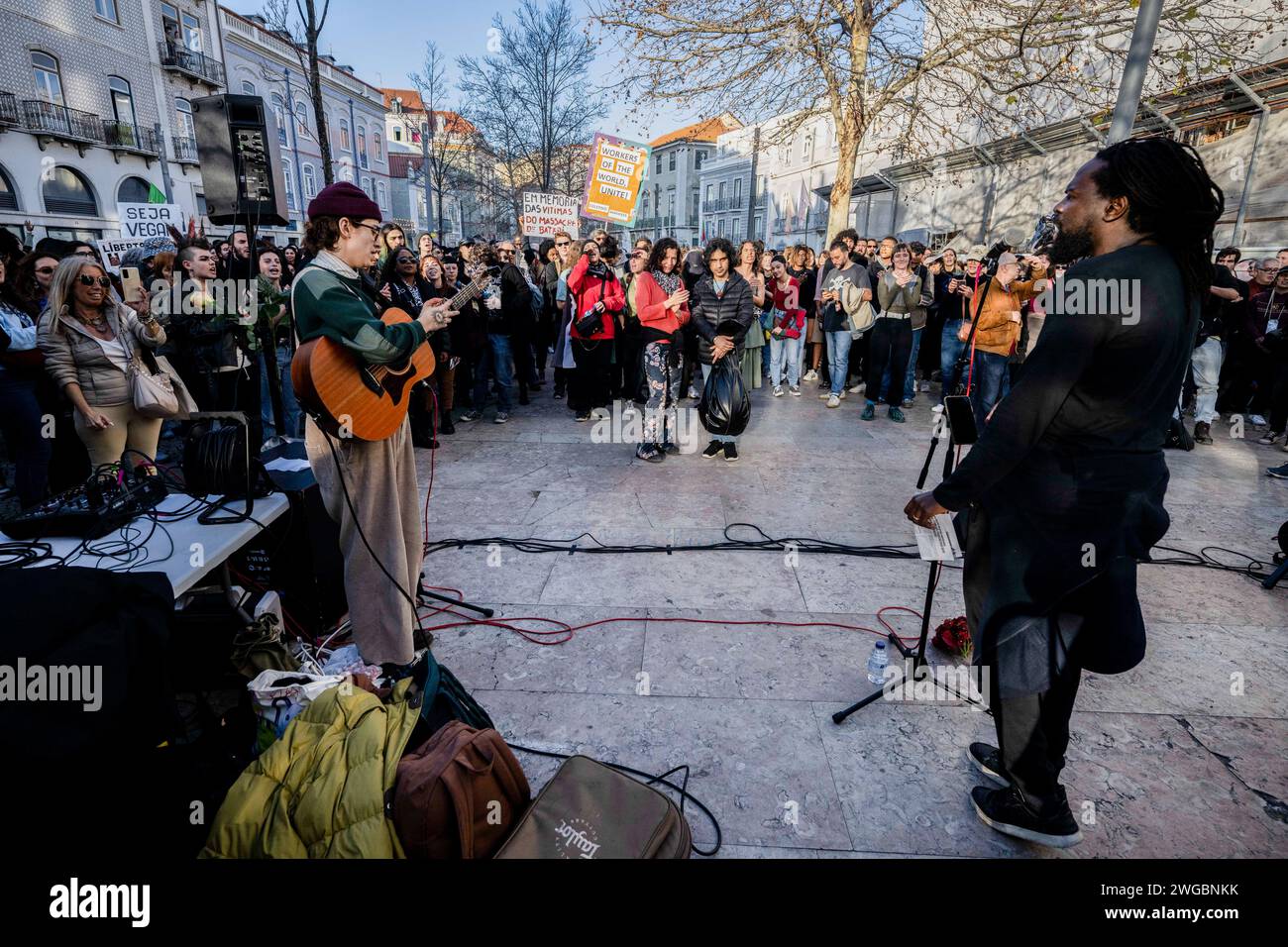 An activist performs a song during the demonstration. The rally was ...