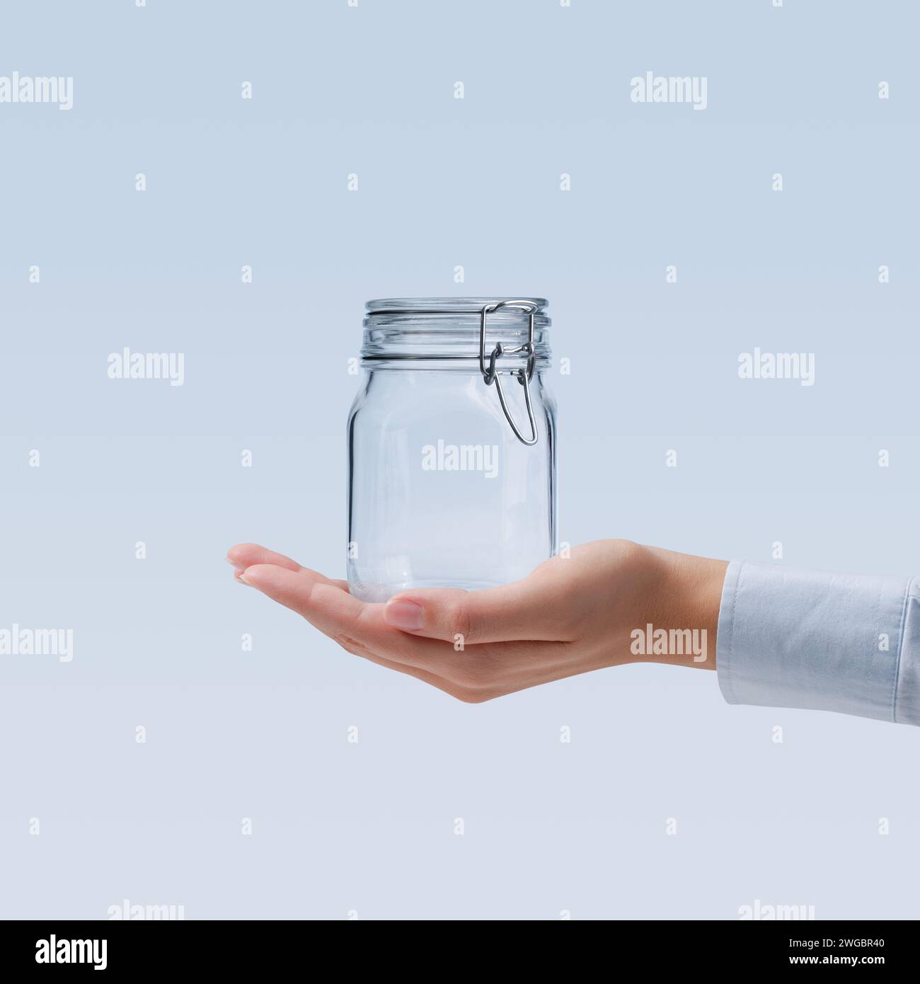 Cupped female hand holding a clean empty glass jar Stock Photo - Alamy