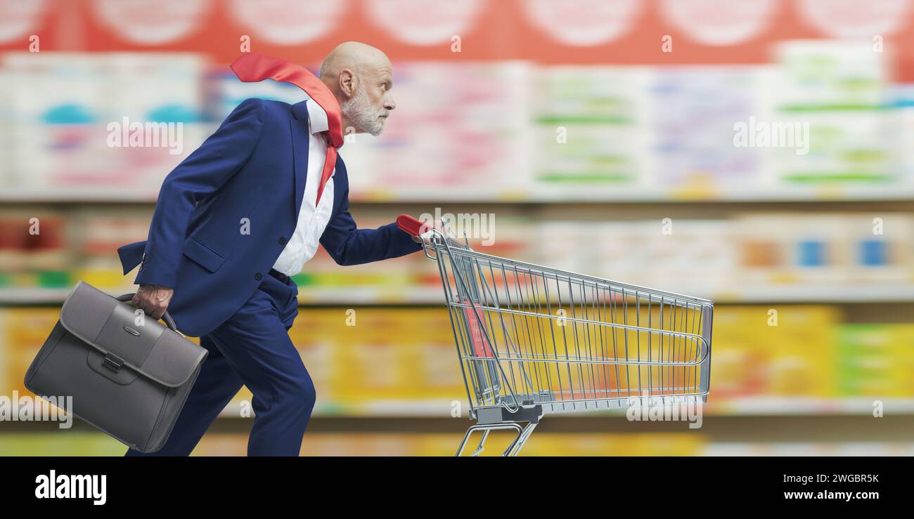 Fast businessman running and pushing a supermarket shopping cart Stock ...