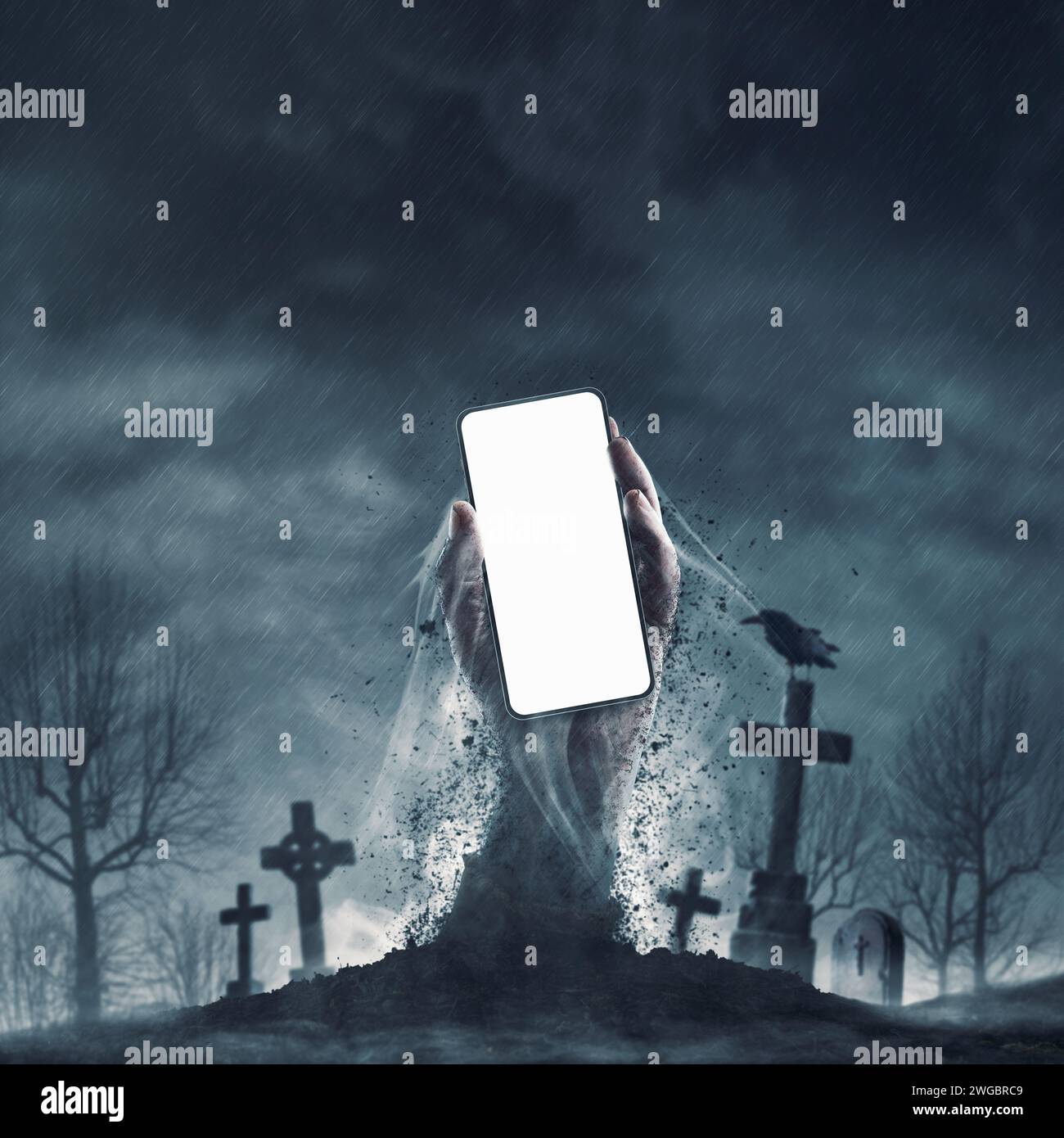 Scary zombie hand coming out of a grave and holding a smartphone with ...