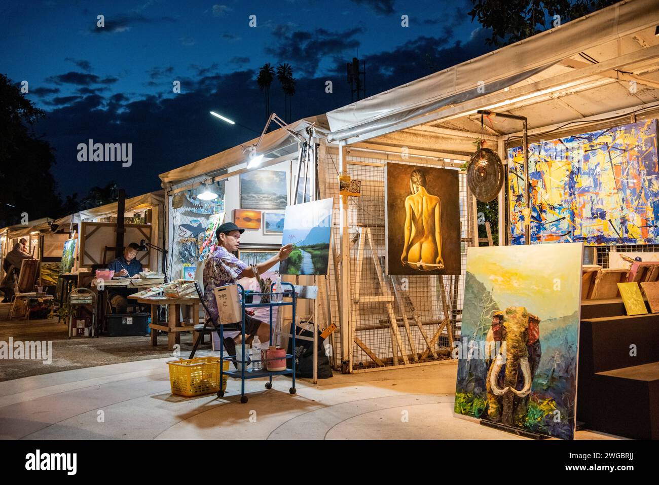 a painter and artist in his shop at the art and Handmade Market at the ...