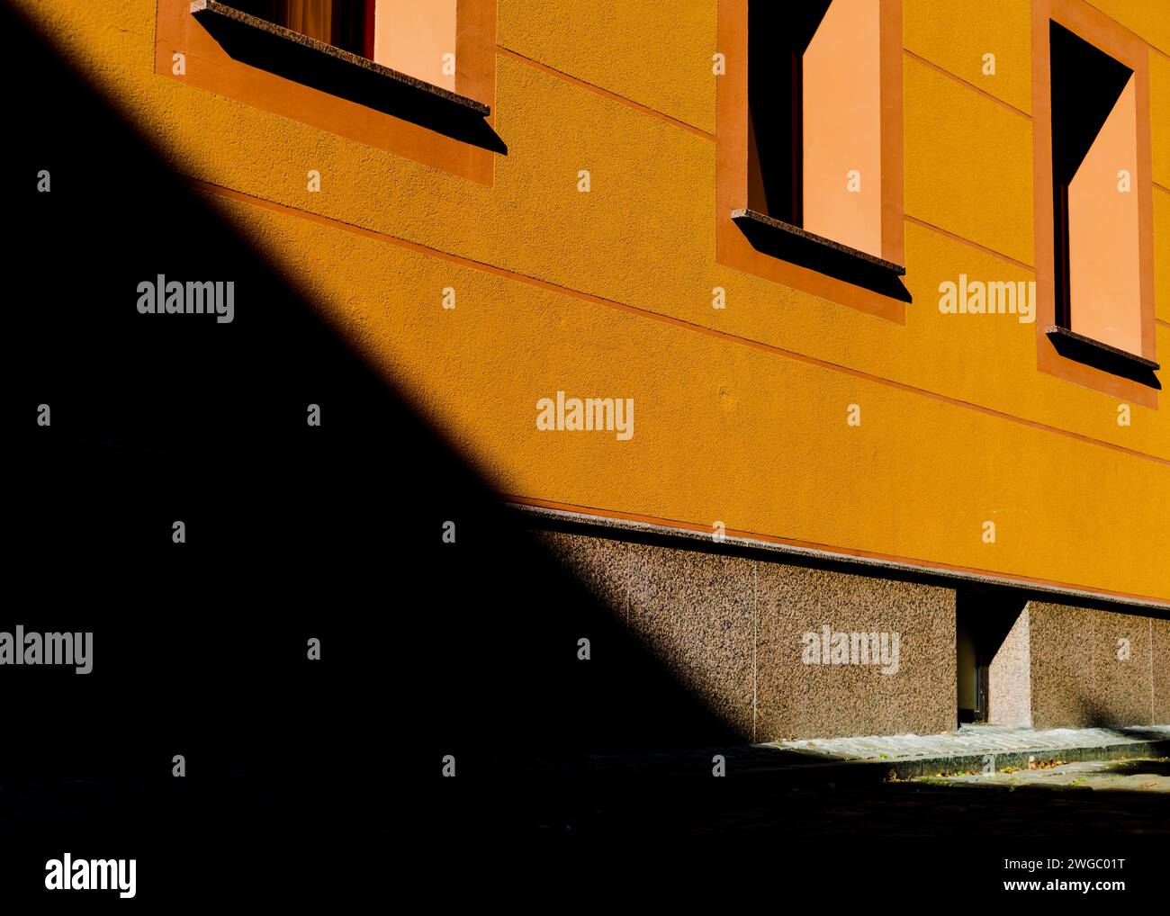 yellow wall of the building illuminated by the sun Stock Photo - Alamy