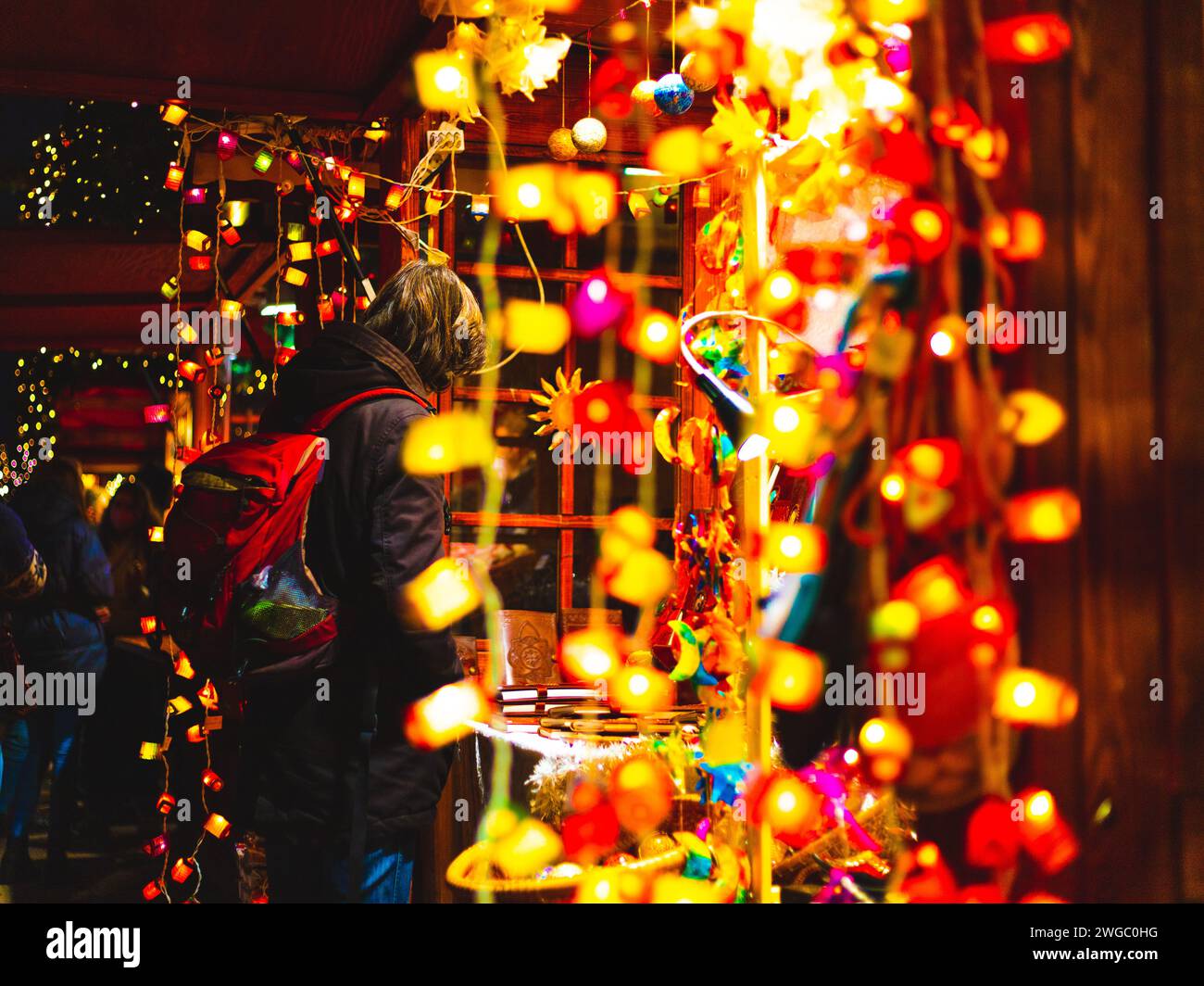 man standing at a market stall at night Stock Photo - Alamy