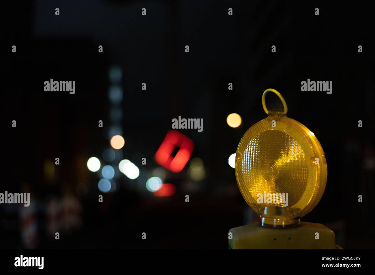 orange warning light on a night street Stock Photo - Alamy