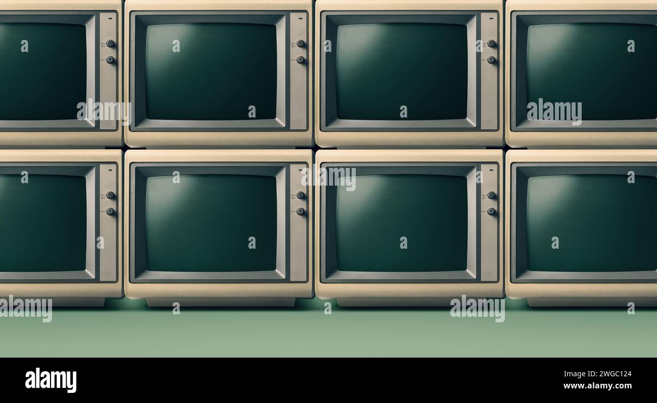 Set of identical old computer monitors stacked and placed next to each ...