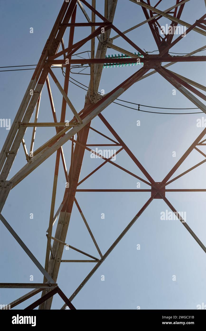Electric pylon. Metal construction that conducts electricity. Red and ...