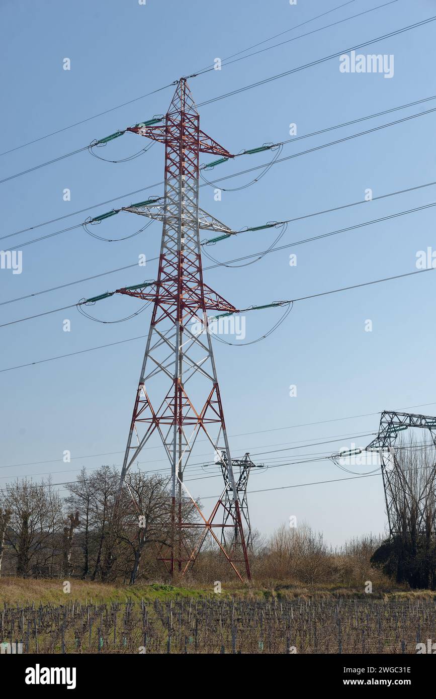 Electric pylon. Metal construction that conducts electricity. Red and ...