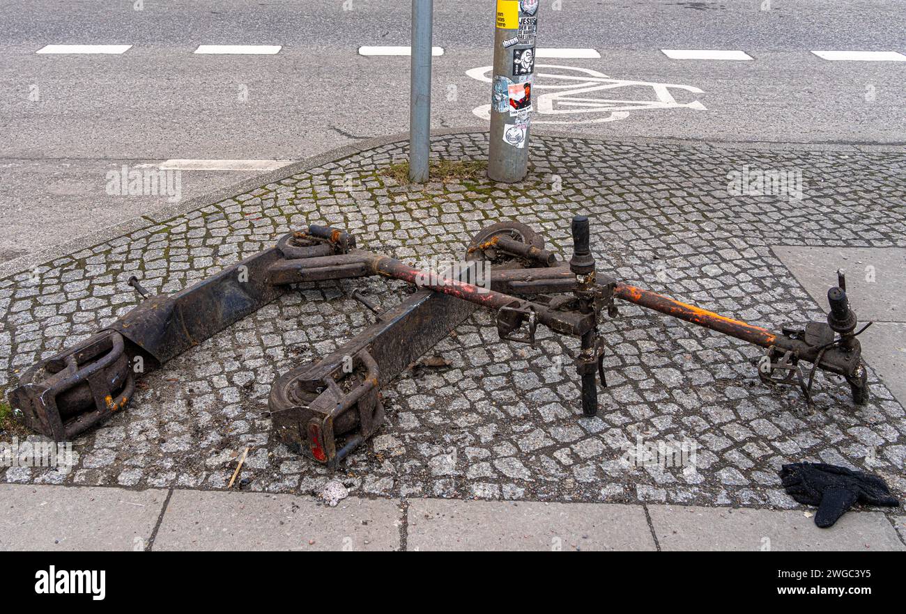 Rusty electric scooters on public streets, East Side Galery in Berlin ...