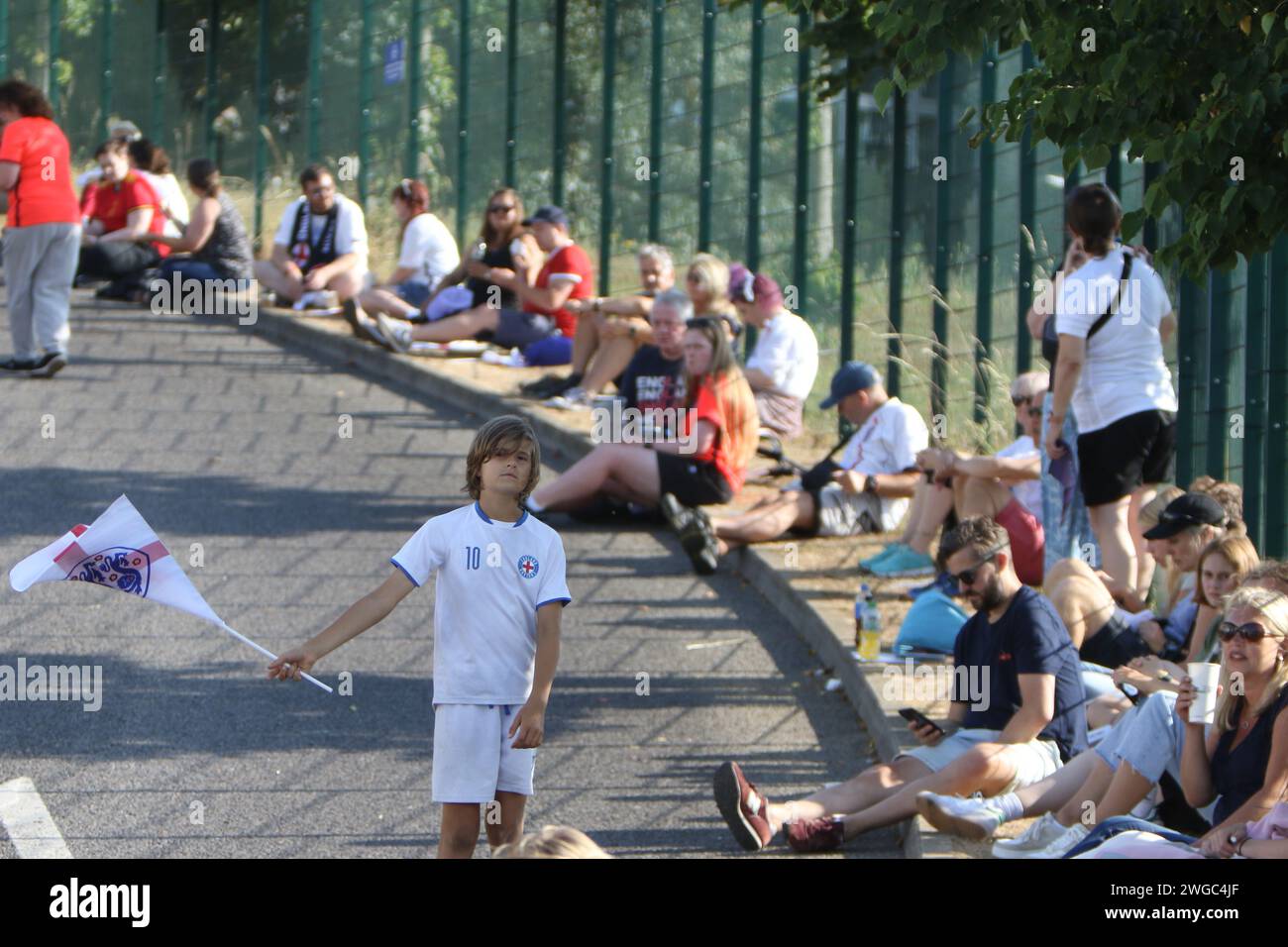 Fans sit on ground hi-res stock photography and images - Alamy