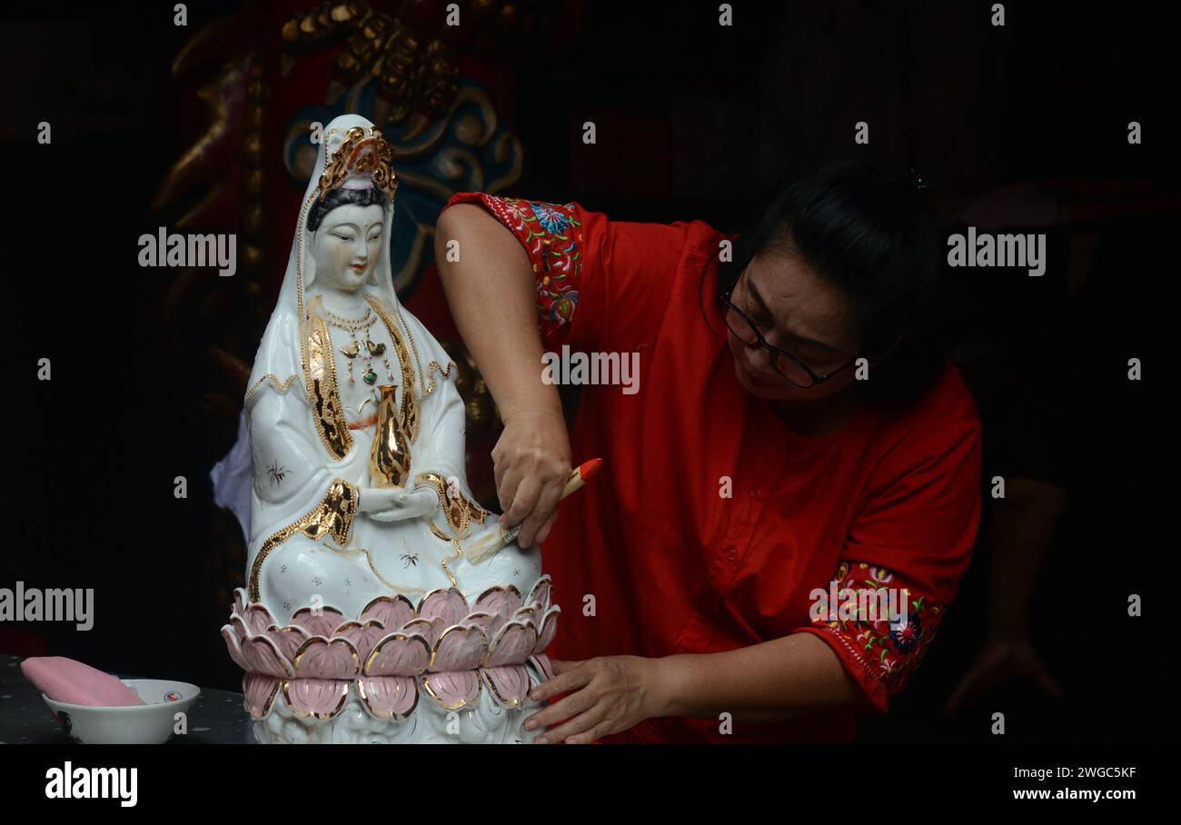 Bogor, West Java, Indonesia. 4th Feb, 2024. A woman is cleaning a ...