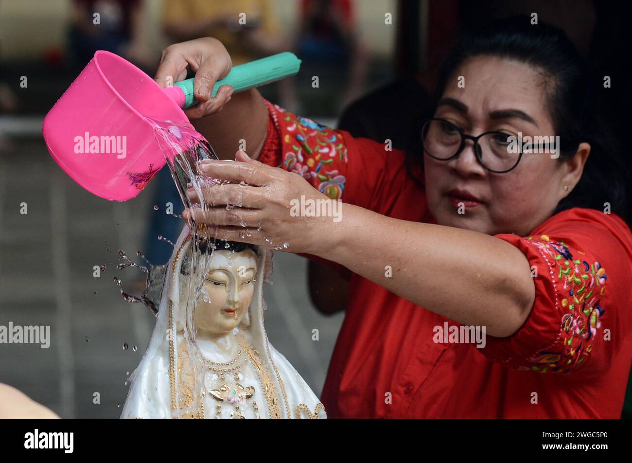 Bogor, West Java, Indonesia. 4th Feb, 2024. A woman is cleaning a ...