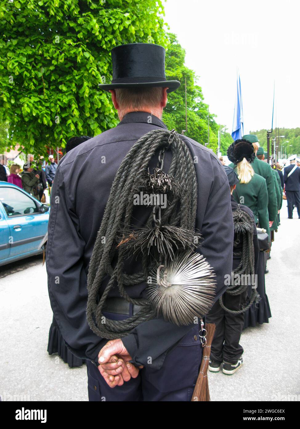 CHIMNEY SWEEPER in a top hat and with parts of his equipment on his ...