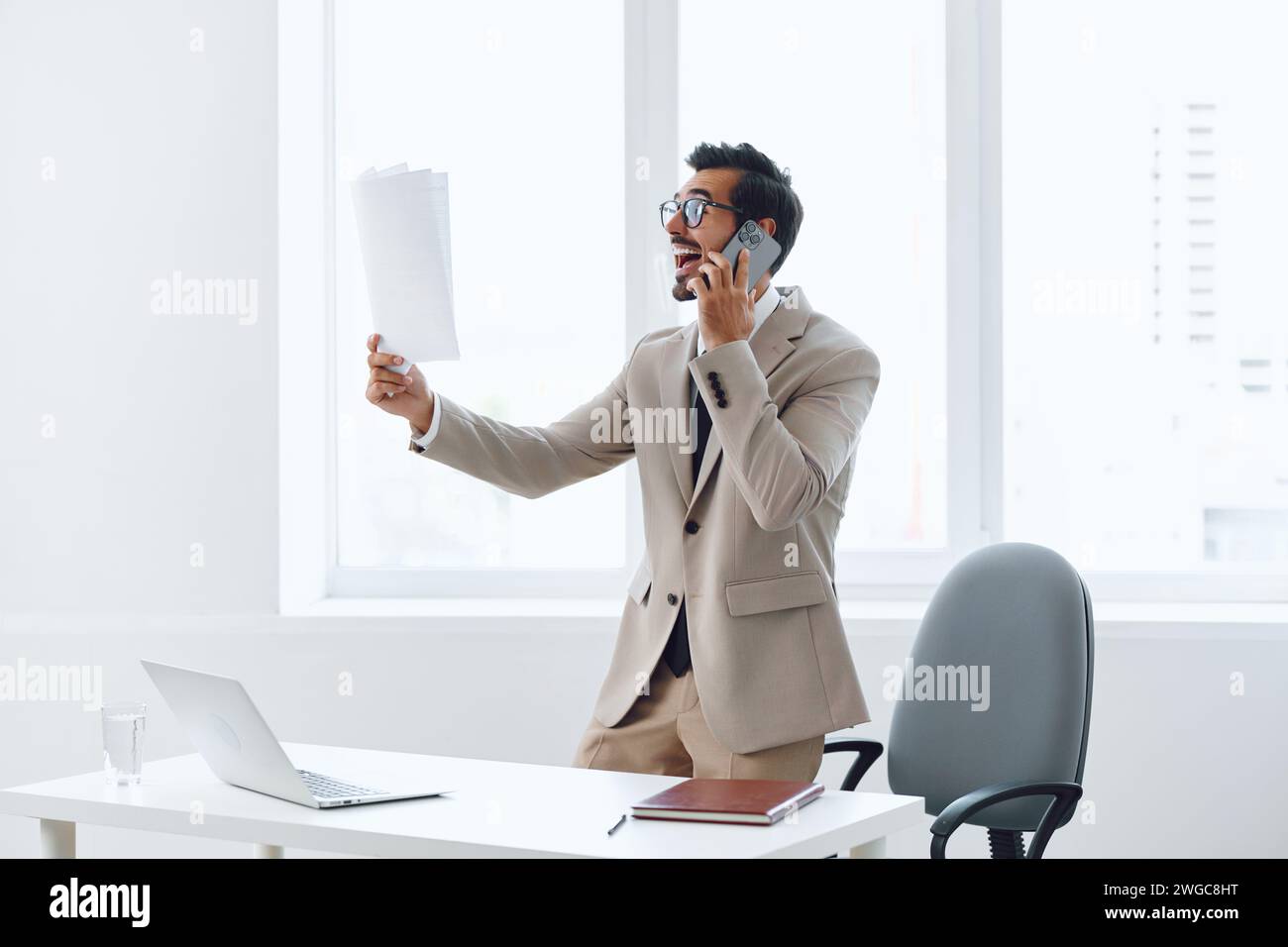 Laptop man businessman office phone computer talk call attractive ...