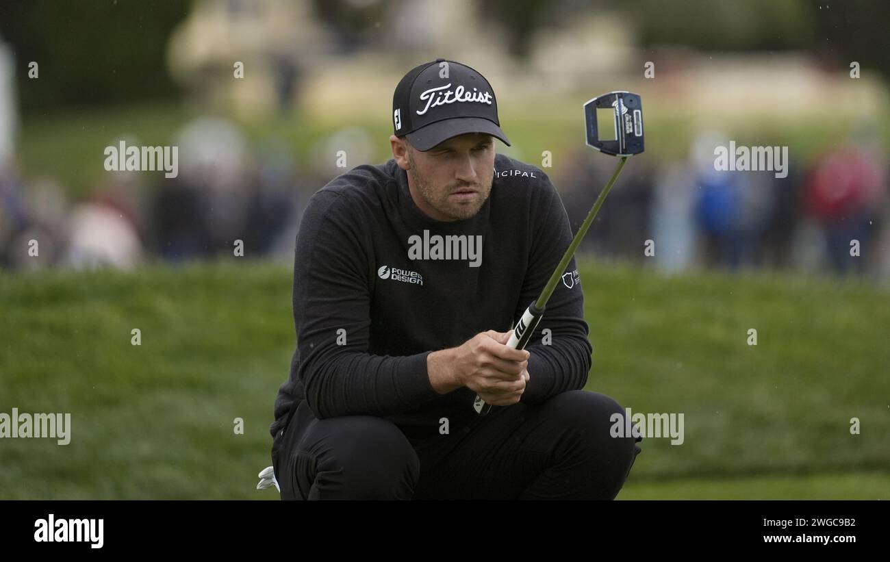 Wyndham Clark lines his putt on the 18th green at Pebble Beach Golf ...