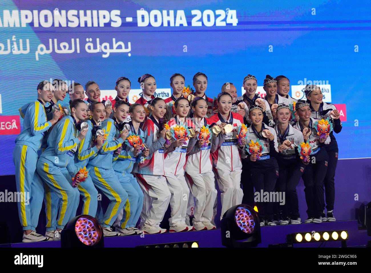 Gold medalists China team, center, silver medalists Ukraine team, left, bronze medalists United ...