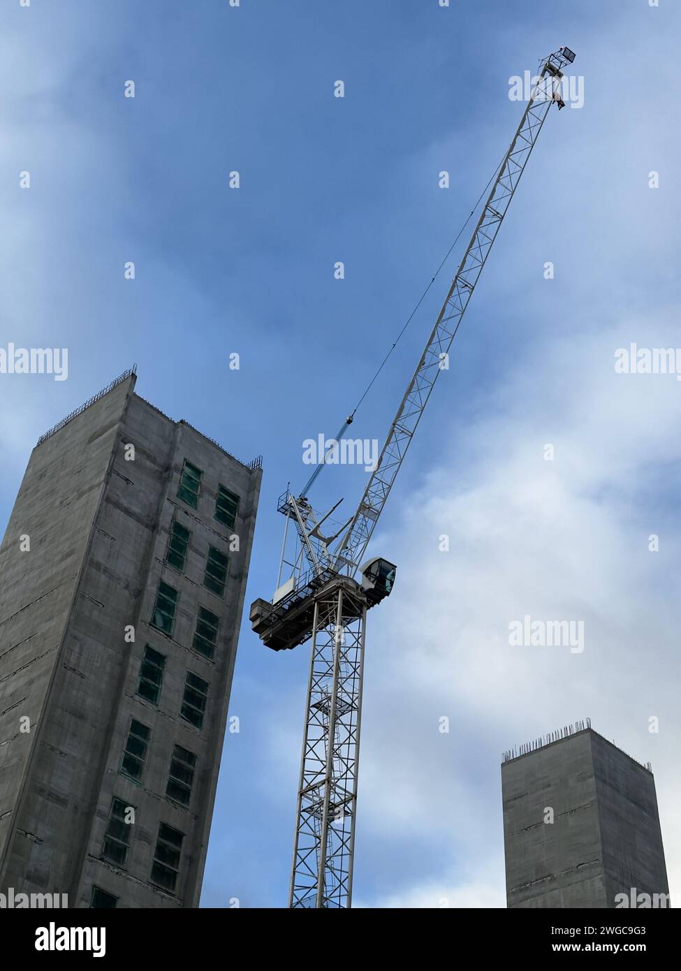 Tower cranes at new high rise apartment development during construction ...