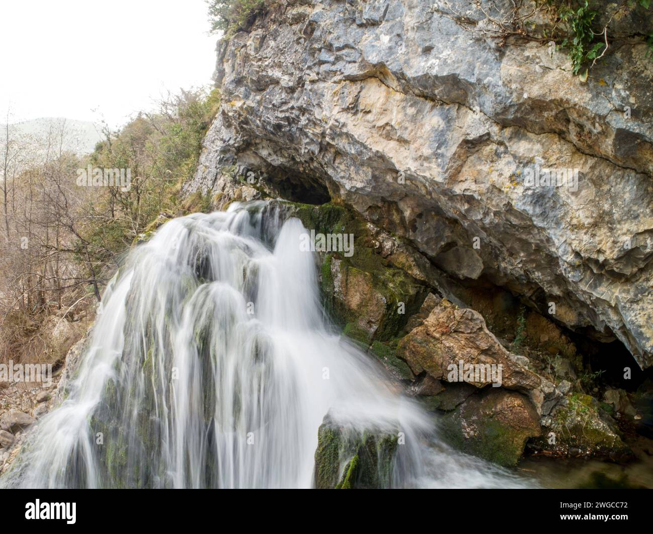 waterfall coming out of the Cueva de Las Güixas, Villanúa, Pyrenees ...