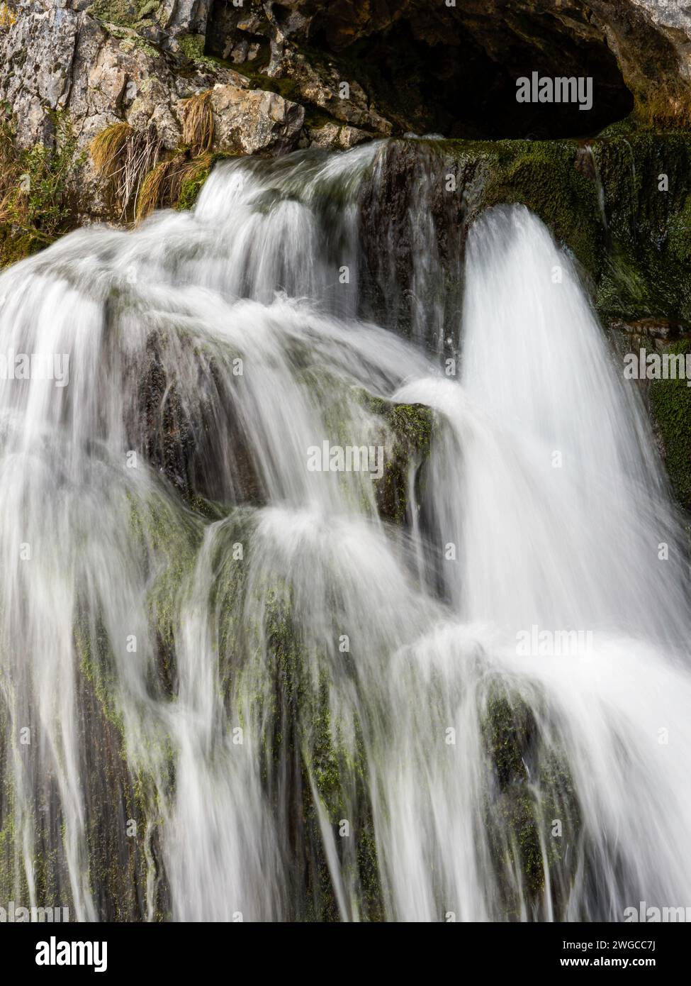 waterfall coming out of the Cueva de Las Güixas, Villanúa, Pyrenees ...