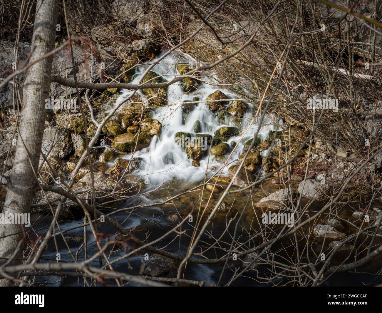 waterfall coming out of the Cueva de Las Güixas, Villanúa, Pyrenees ...