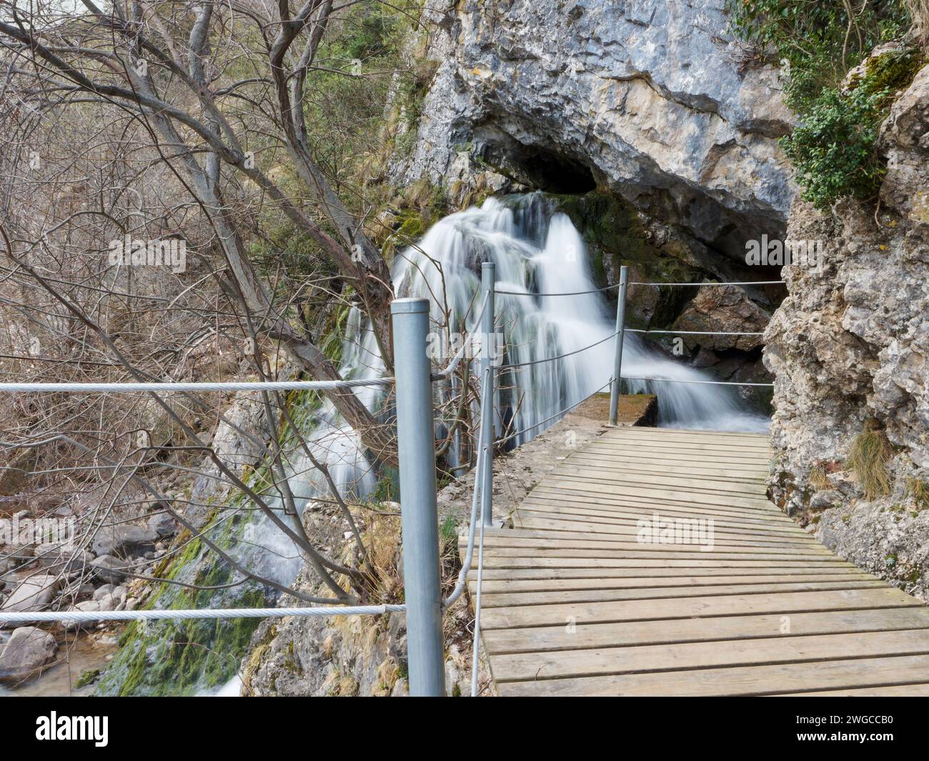 waterfall coming out of the Cueva de Las Güixas, Villanúa, Pyrenees ...