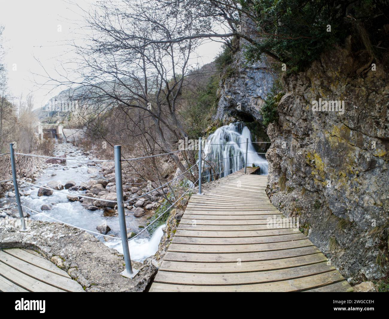 waterfall coming out of the Cueva de Las Güixas, Villanúa, Pyrenees ...