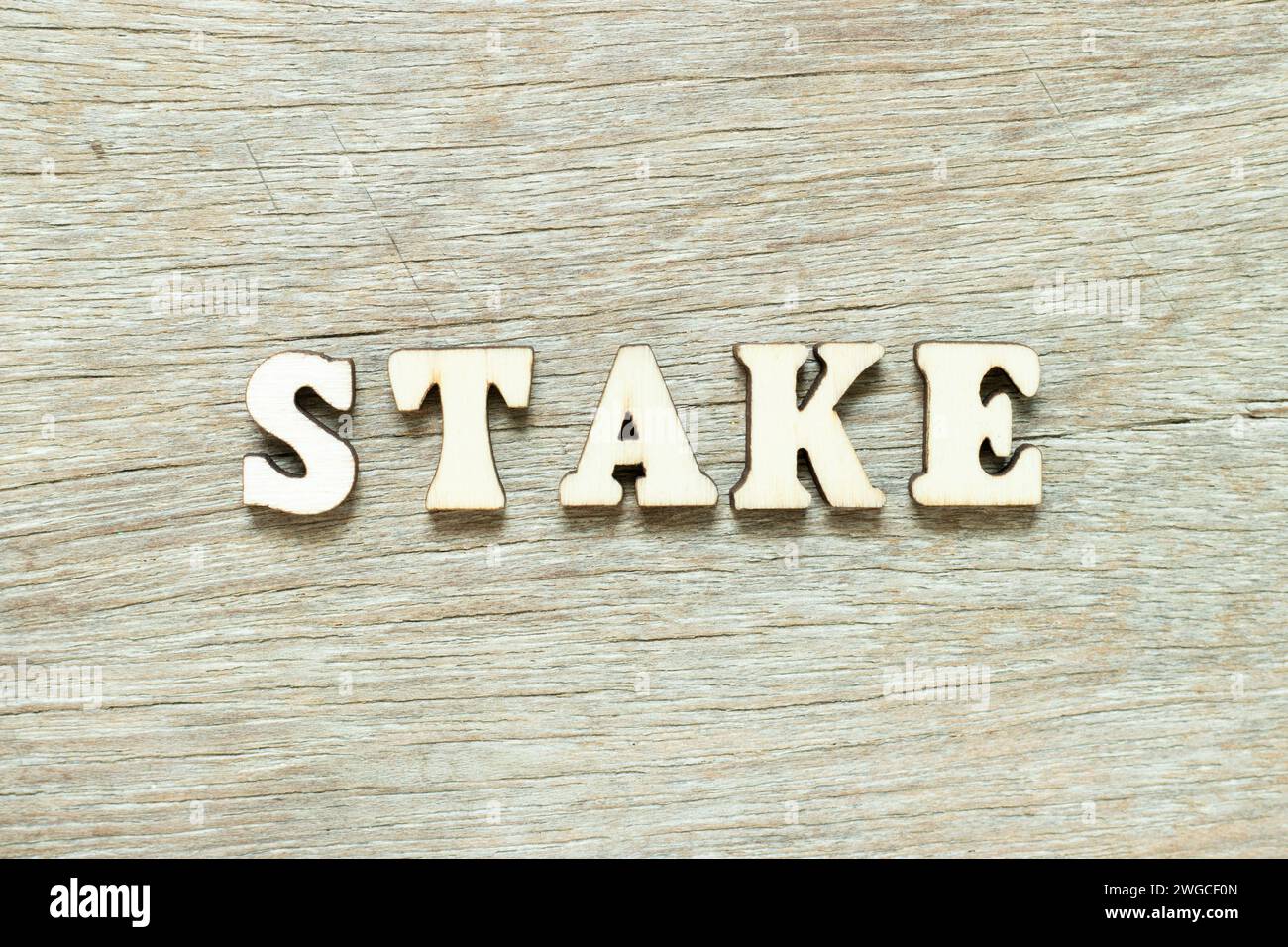Alphabet letter in word stake on wood background Stock Photo - Alamy