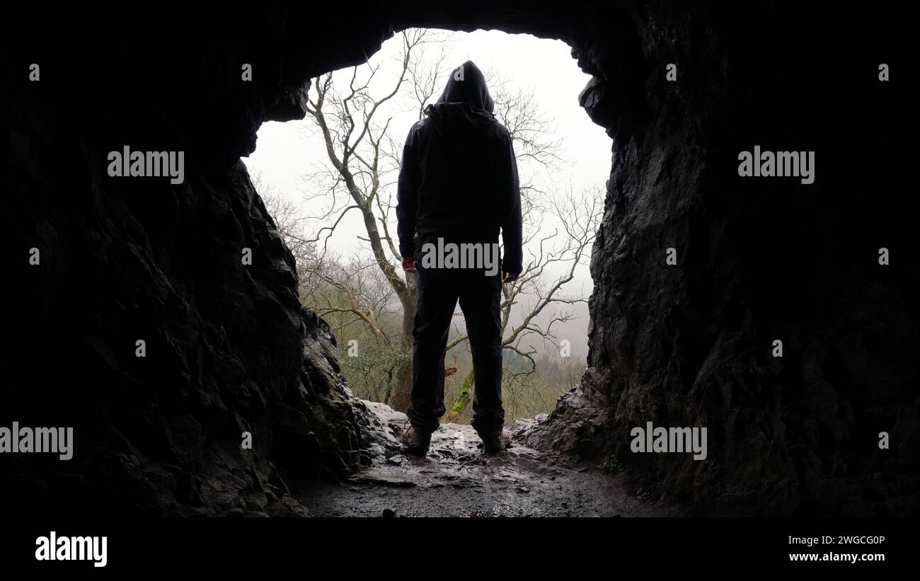 A scary horror figure, back to camera. Standing on the entrance to a ...