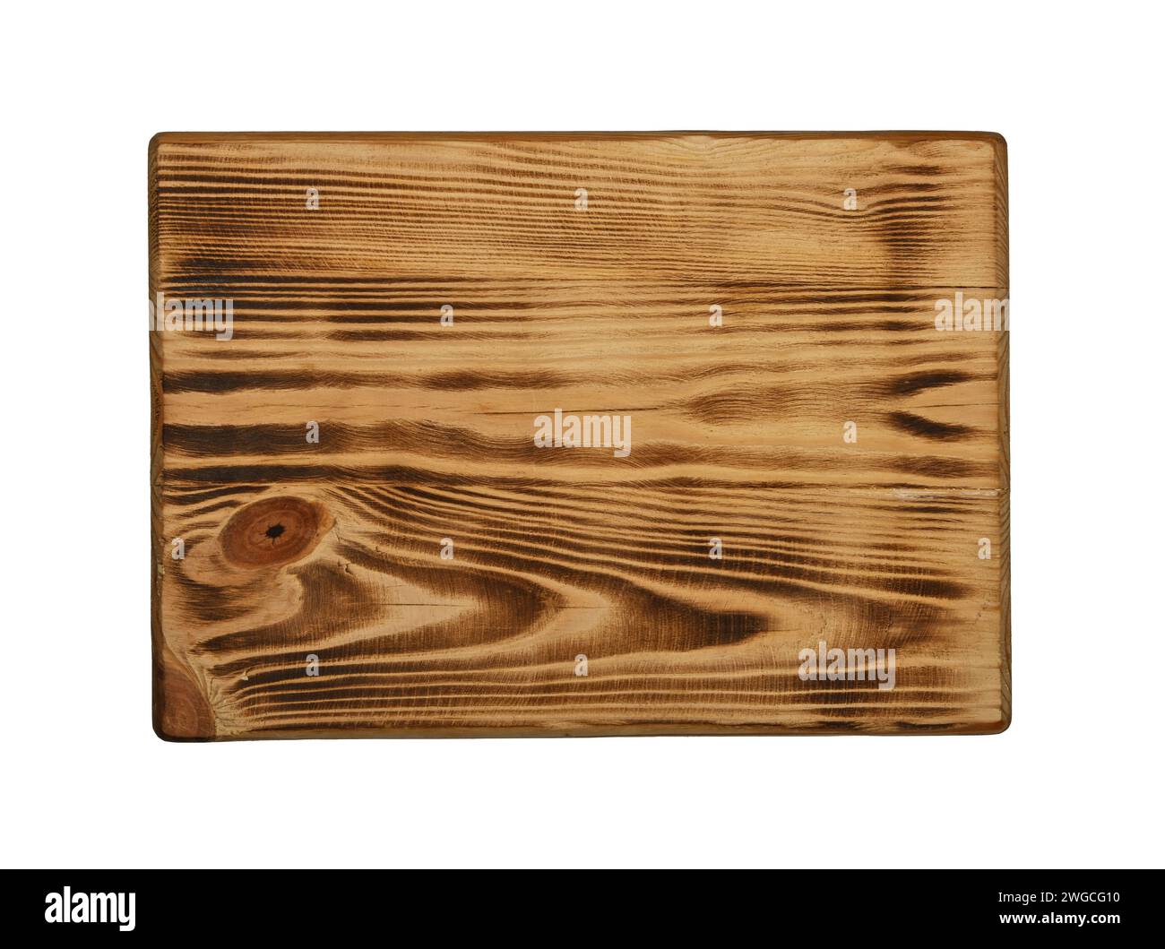 Close up of one brown oak wood kitchen cutting board with dark burnt ...