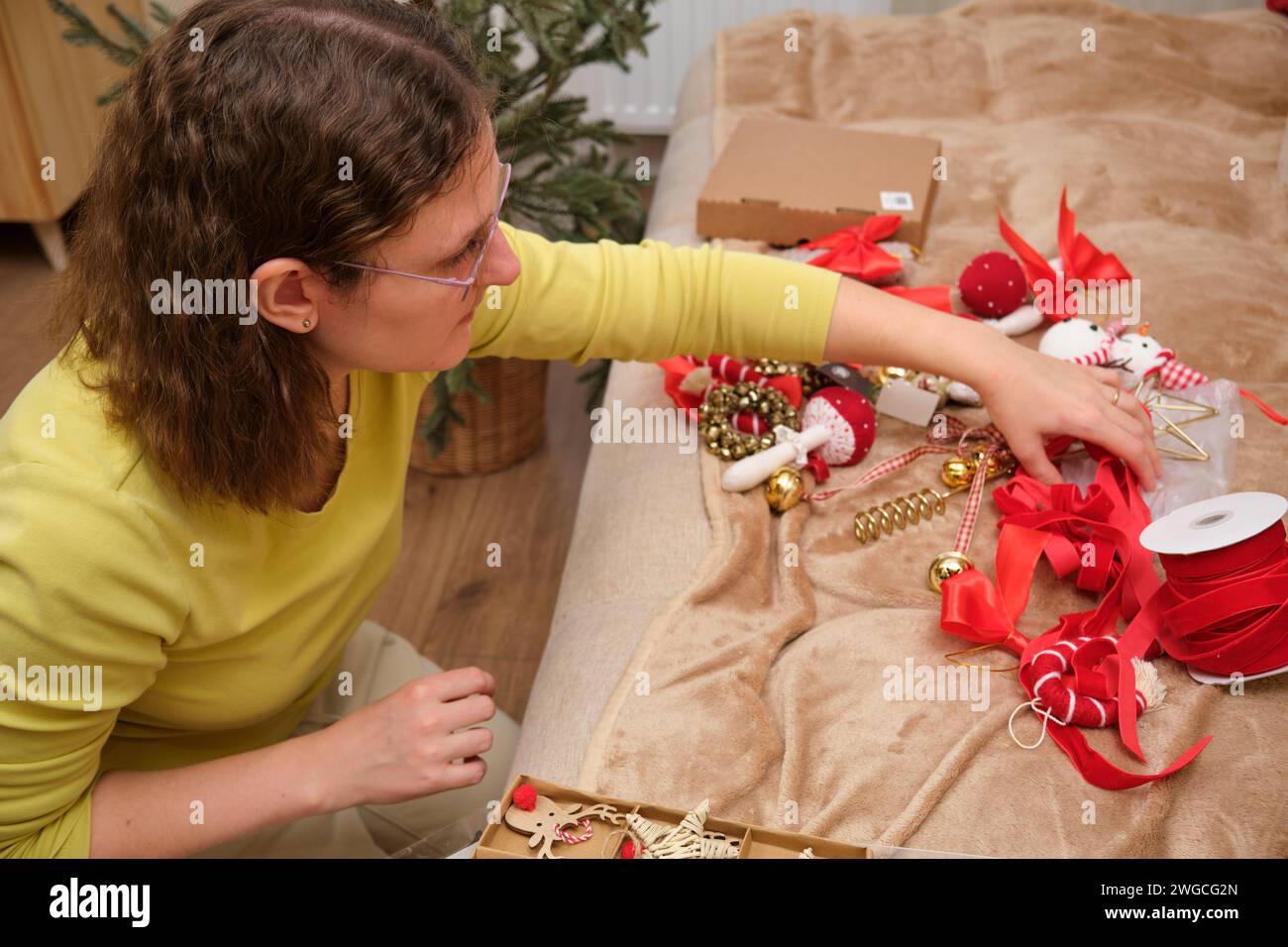 Cleaning up Christmas tree decorations in the home room after Christmas ...