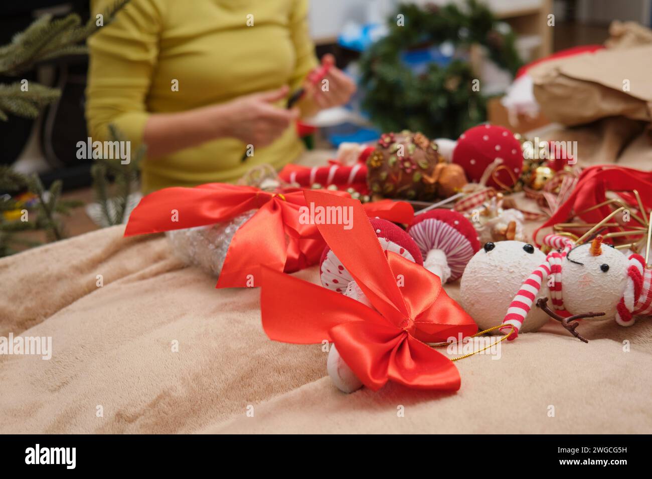 Cleaning up Christmas tree decorations in the home room after Christmas ...