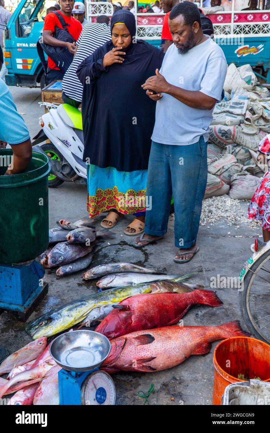 fish seller at the market in Stone Town in Zanzibar Stock Photo - Alamy