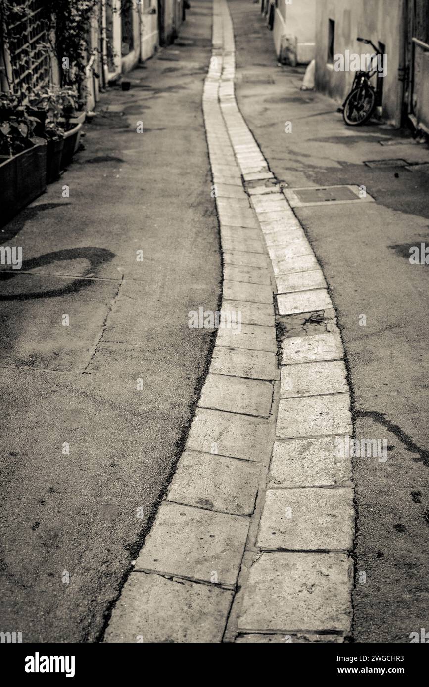 Shallow canal for taking down rainwater in a street in Montpellier ...