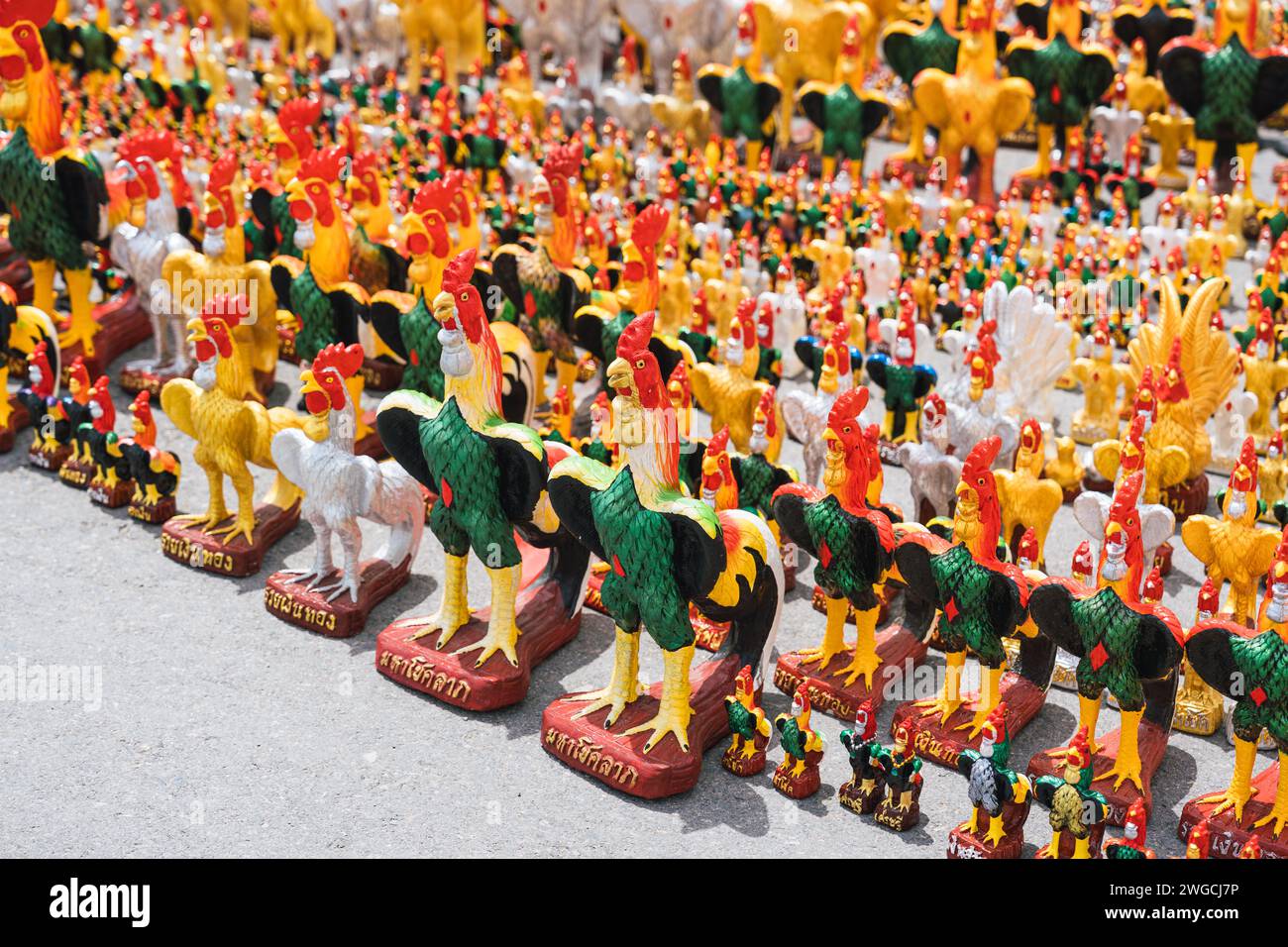 Many various size of chickens statue are worship and placed at the ...