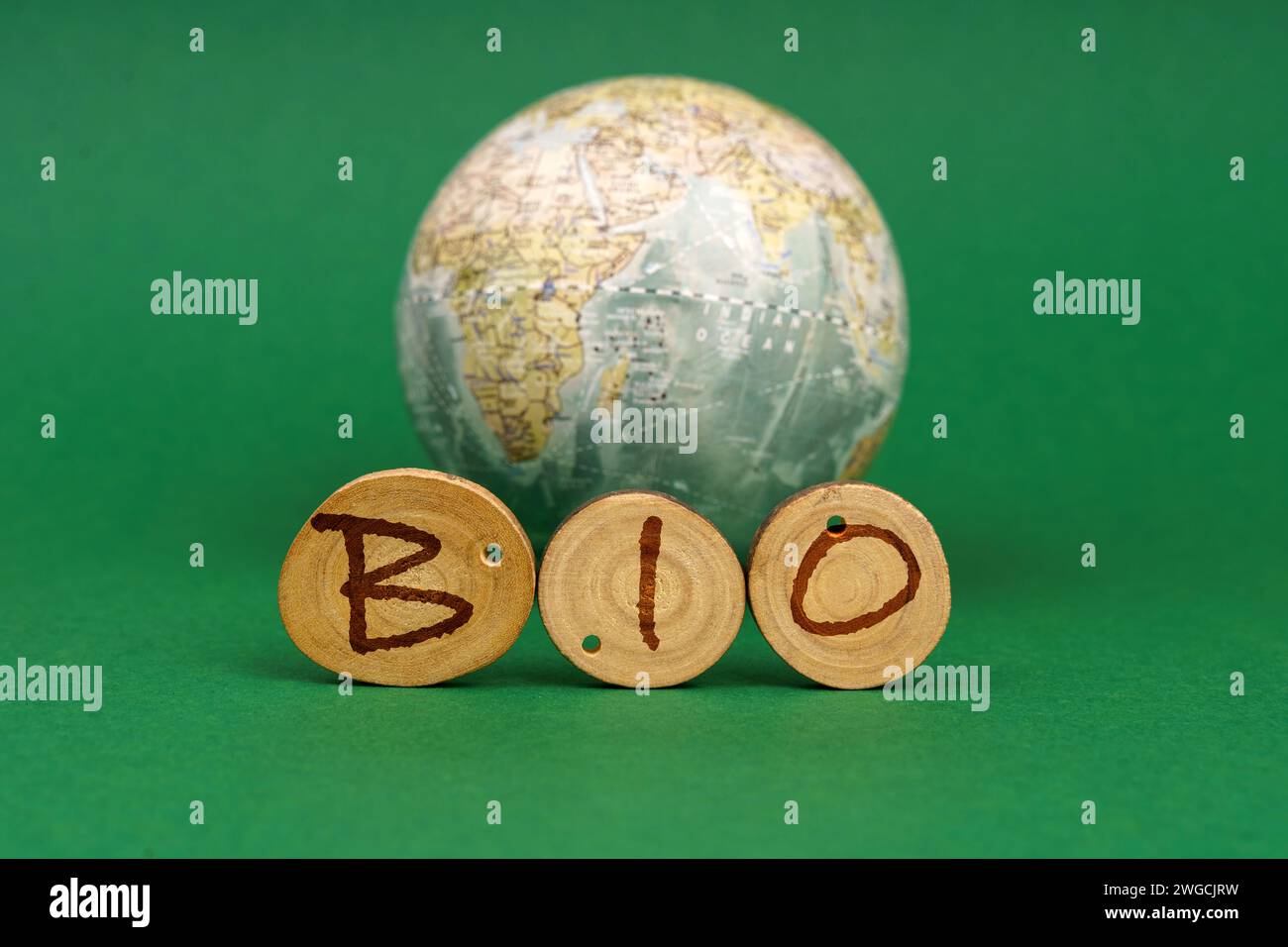 Ecological concept. On a green background there is an Earth globe and ...