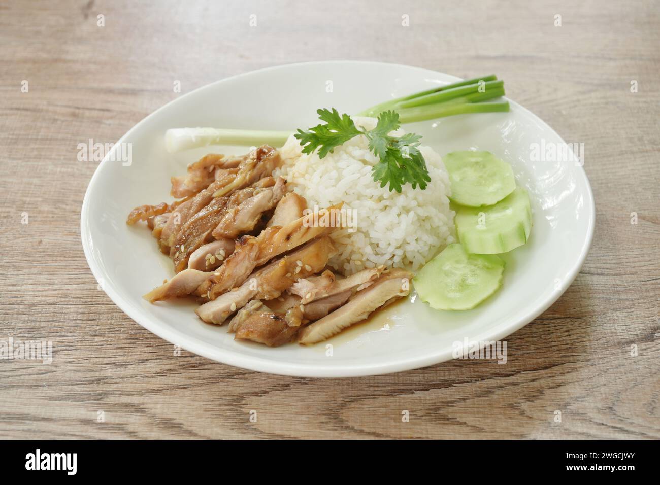 slice grilled chicken topping white sesame with Teriyaki Japanese sauce ...