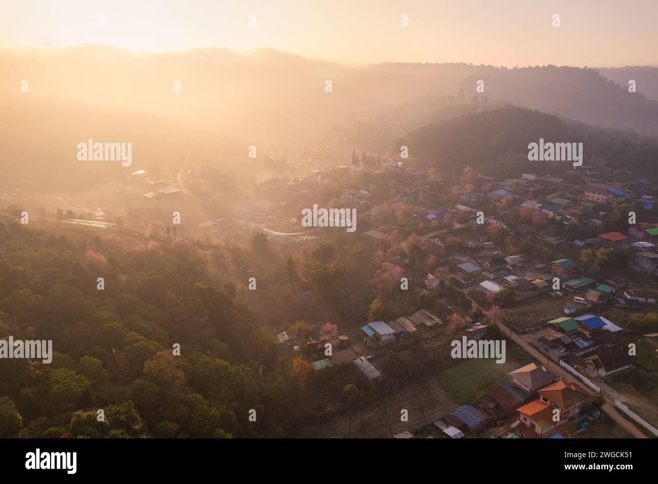 Beautiful sunrise over Thai tribe village in foggy with wild himalayan ...