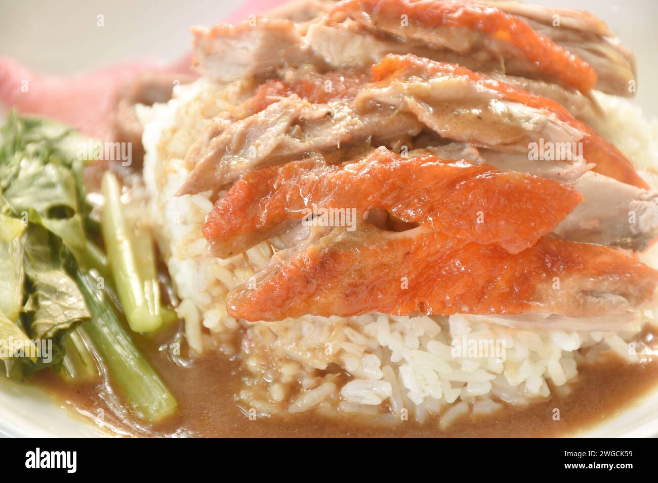 slice roasted duck topping rice with pink pickled ginger and boiled ...