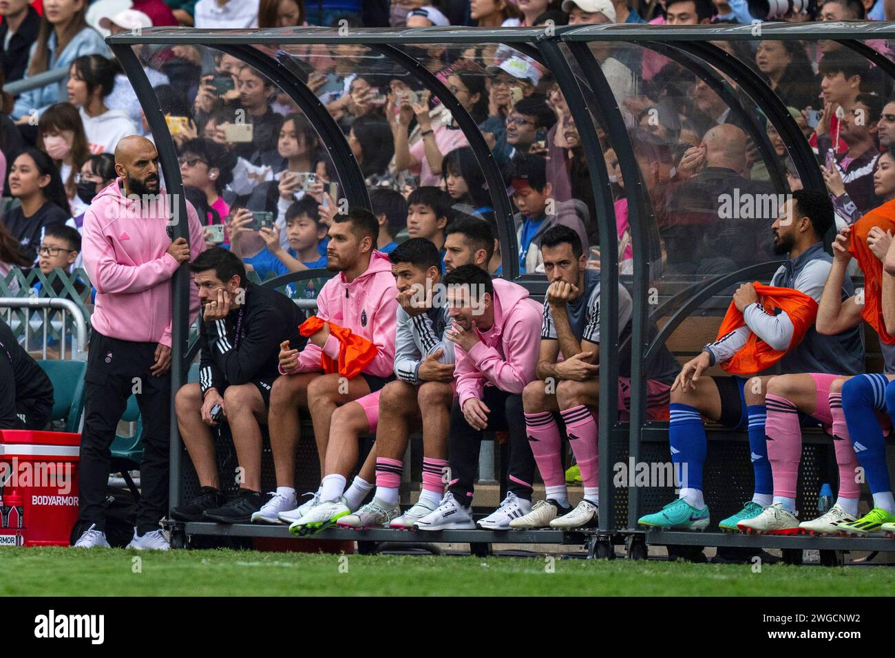 Inter Miami's Lionel Messi, sixth from left, looks on from the bench ...