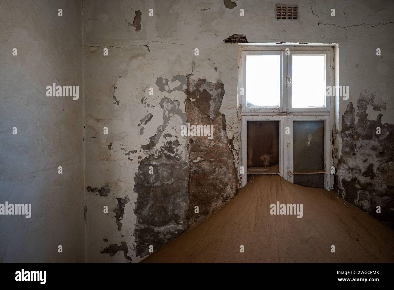An aged, dilapidated room with walls displaying peeling paint Stock ...