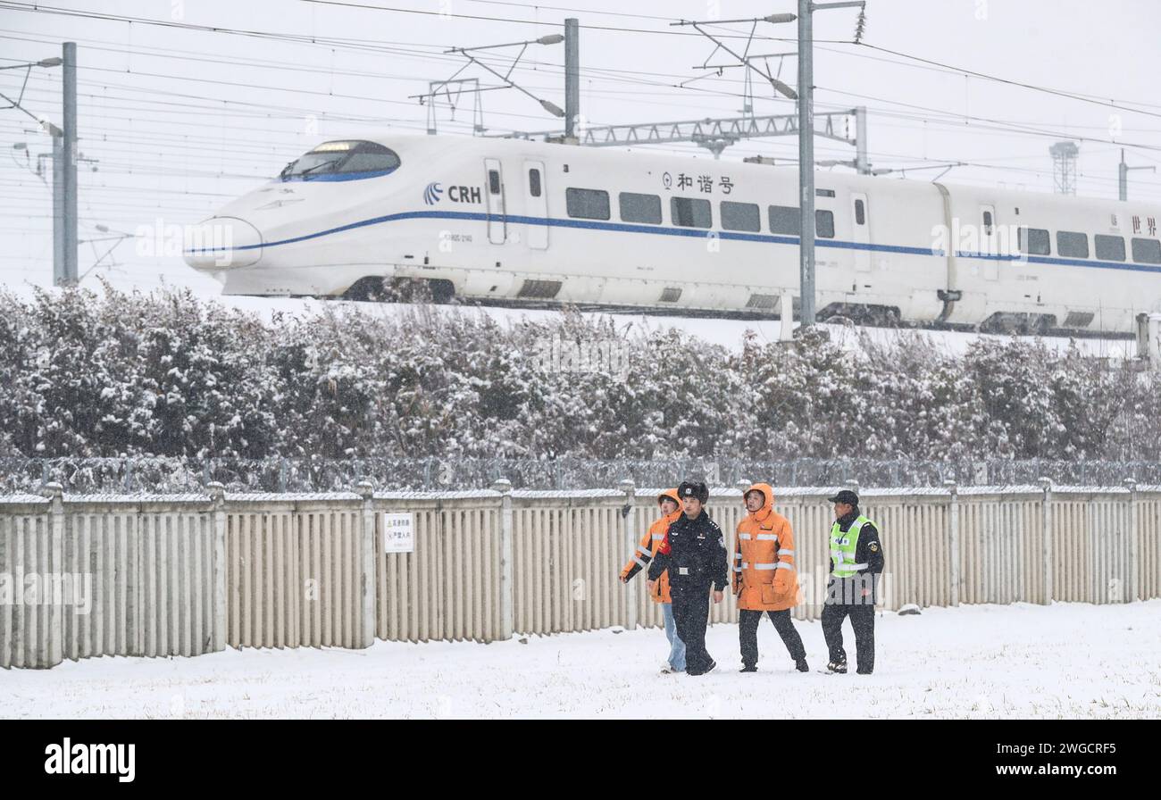 Beijing, China's Jiangsu Province. 4th Feb, 2024. Policemen and high ...