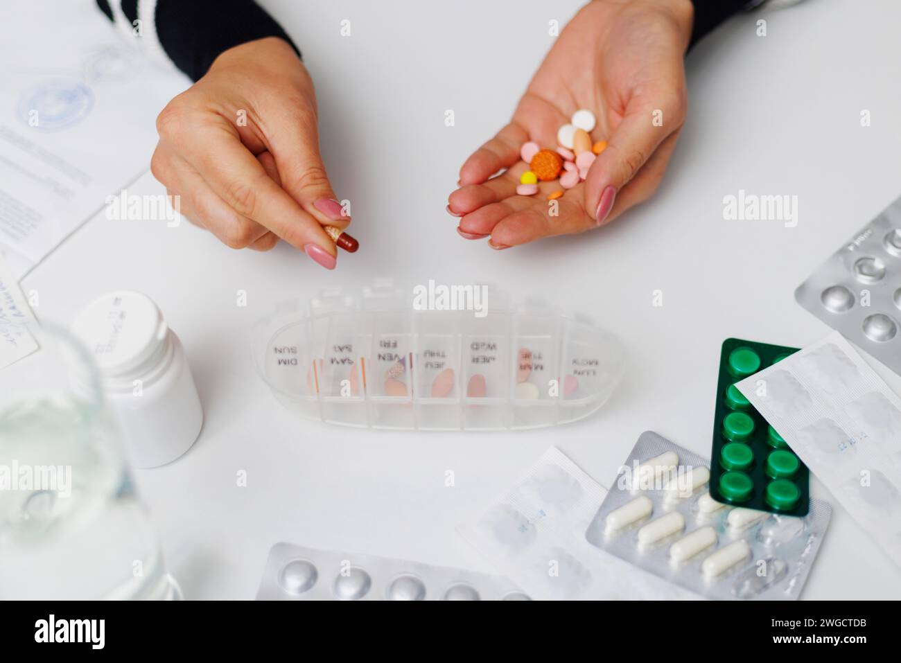 Organized Daily Medication on White Background Stock Photo - Alamy
